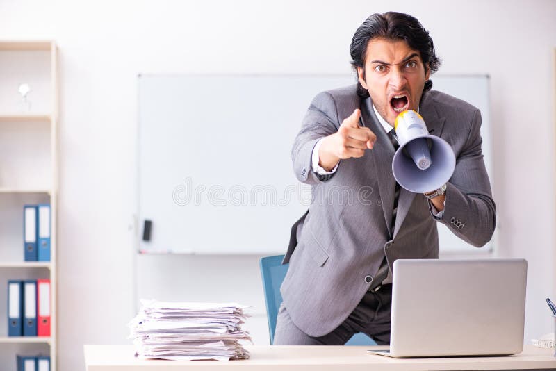 The Young Employee Boss with Megaphone in the Office Stock Image ...