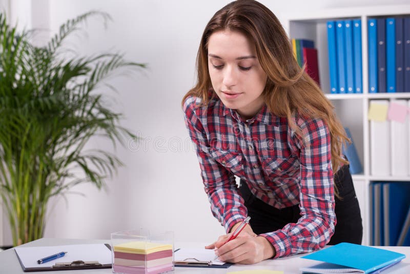 Young Employee Checking the List Stock Photo - Image of files, locker ...