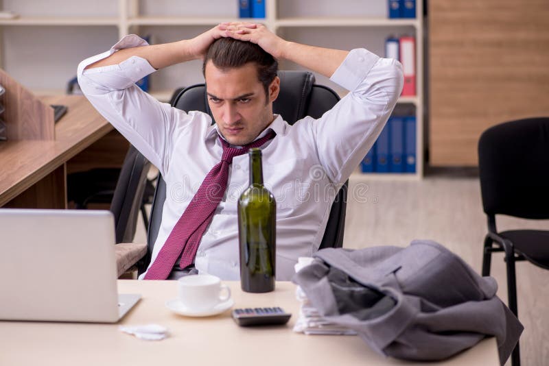 Young Male Employee Drinking Alcohol in the Office Stock Photo - Image ...