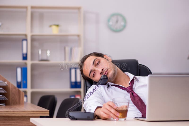 Young Male Employee Drinking Alcohol in the Office Stock Image - Image ...