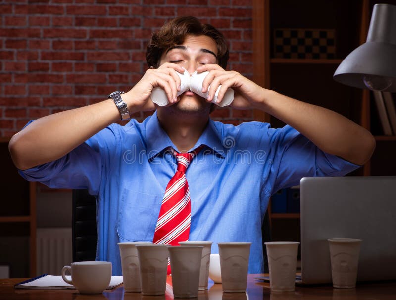 Young Employee Drinking Coffee Working at Night Shift Stock Image ...