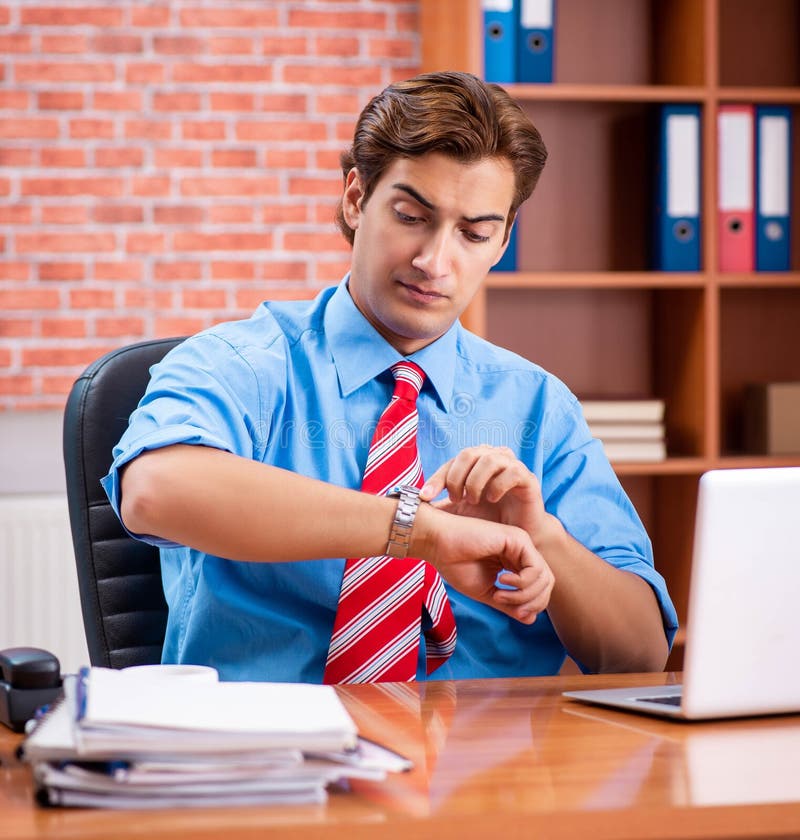 Young Employee with Excessive Work Sitting at the Office Stock Image ...