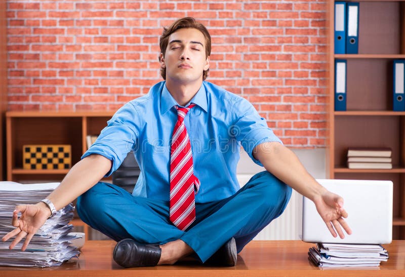 Young Employee with Excessive Work Sitting at the Office Stock Image ...
