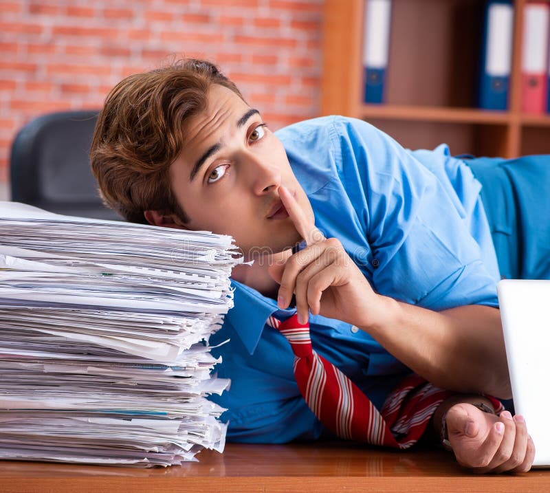 Young Employee with Excessive Work Sitting at the Office Stock Image ...