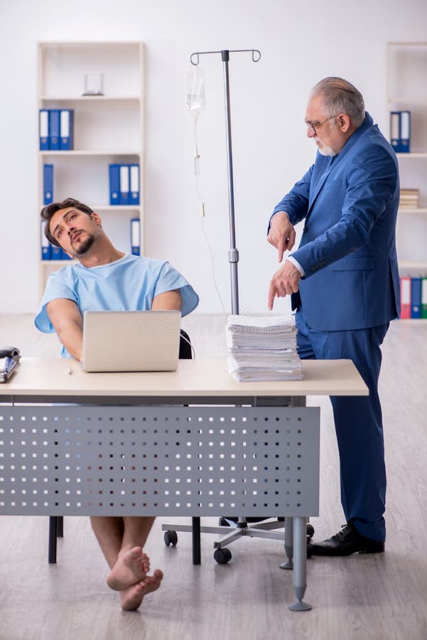 Young Male Employee Feeling Bad at Workplace Stock Photo - Image of ...