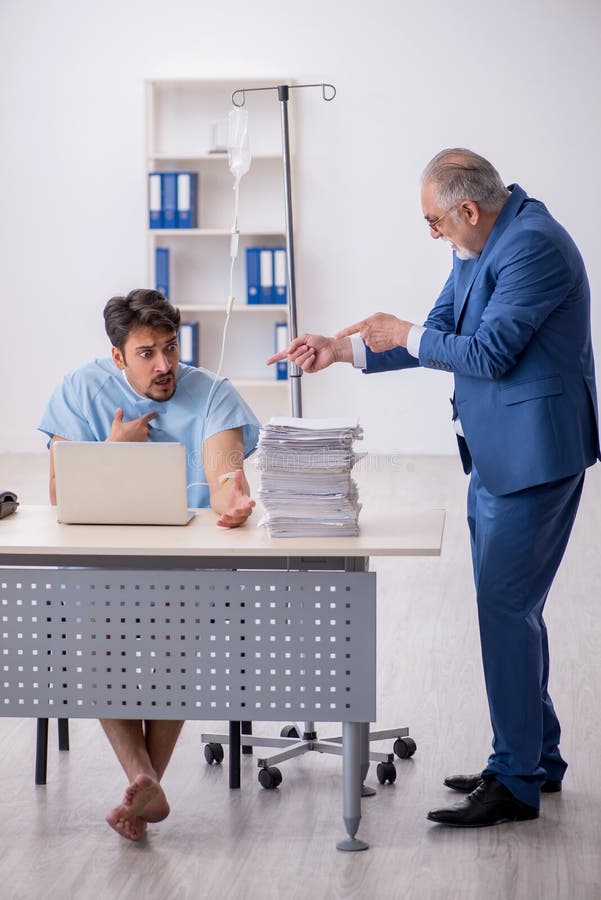 Young Male Employee and Too Much Work in the Office Stock Photo - Image ...