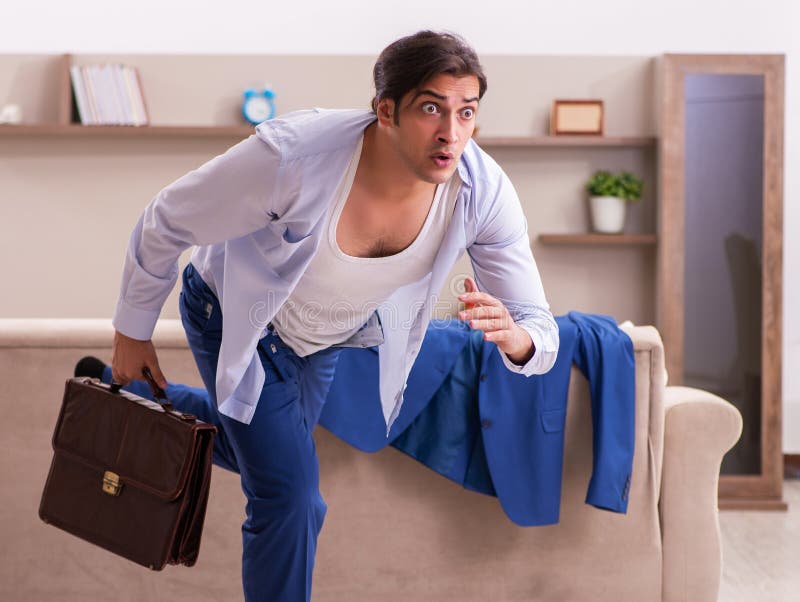 Young Male Employee Getting Up Late at Home Stock Photo - Image of ...
