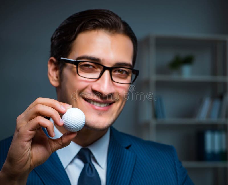 Young Employee with Golf Ball in Office Stock Photo - Image of golfing ...