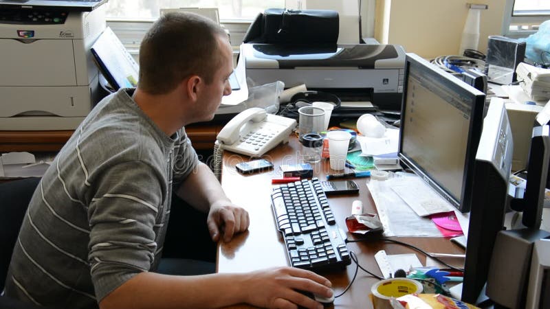 Young Employee Looking at Computer Monitor Stock Video - Video of ...