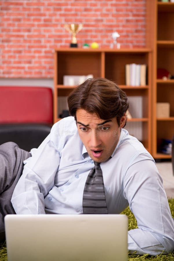 The Young Employee Lying on the Floor at Office Stock Image - Image of ...