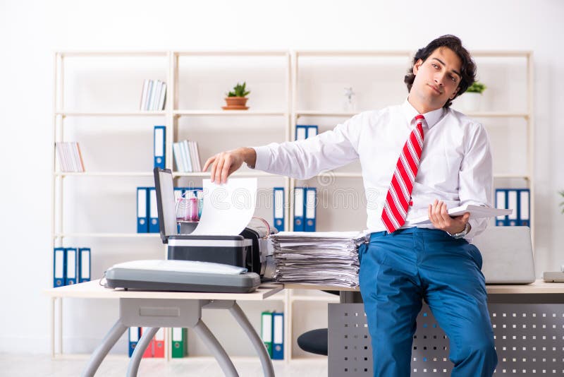 The Young Employee Making Copies at Copying Machine Stock Photo - Image ...