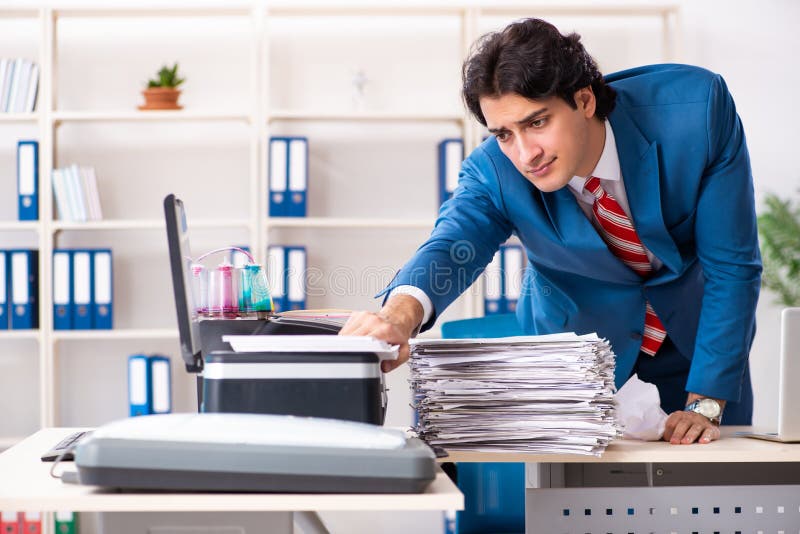 Young Employee Making Copies at Copying Machine Stock Image - Image of ...