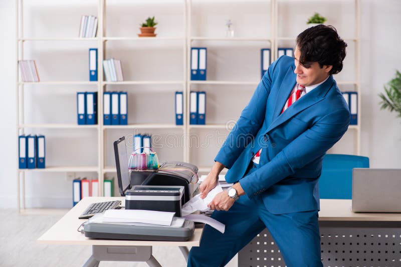 The Young Employee Making Copies at Copying Machine Stock Image - Image ...