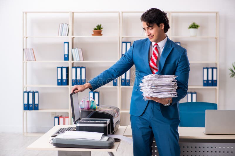 Young Employee Making Copies at Copying Machine Stock Photo - Image of ...