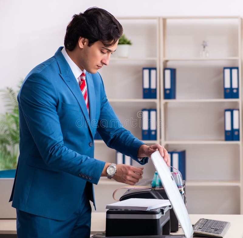 Young Employee Making Copies at Copying Machine Stock Photo - Image of ...