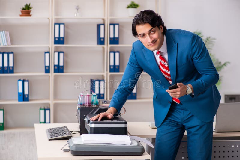 Young Employee Making Copies at Copying Machine Stock Image - Image of ...