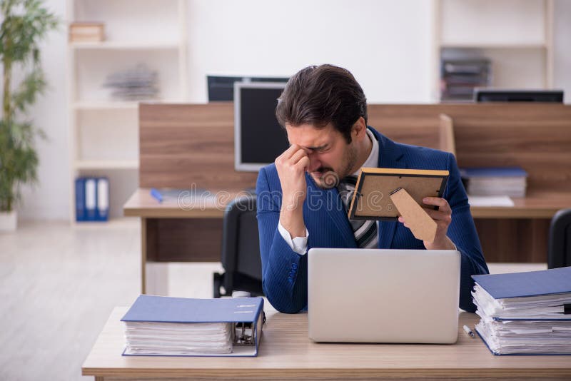 Young Male Employee Missing Girlfriend at Workplace Stock Photo - Image ...