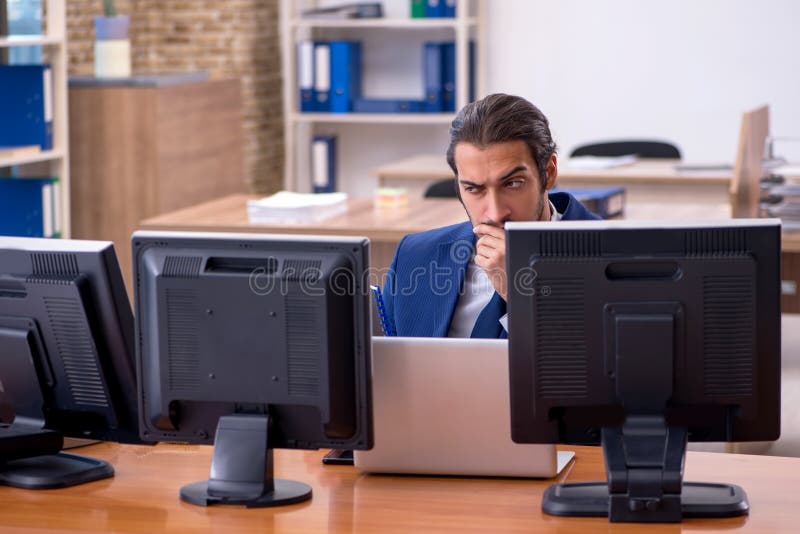 Young Male Employee in Multitasking Concept Stock Image - Image of ...