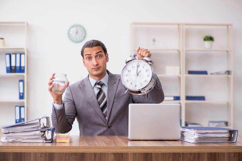 Young Male Employee in Pension Concept at Workplace Stock Image - Image ...