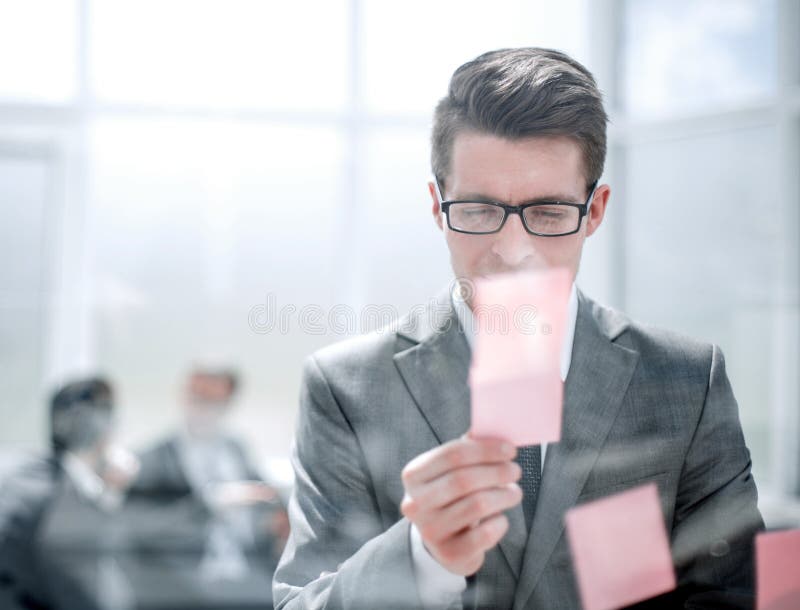 Young Employee Reading a Note on the Glass. Stock Image - Image of ...
