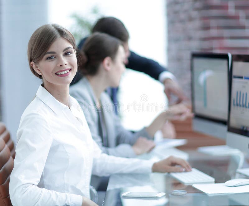 Young Employee Sitting at a Desk Stock Photo - Image of electronic ...