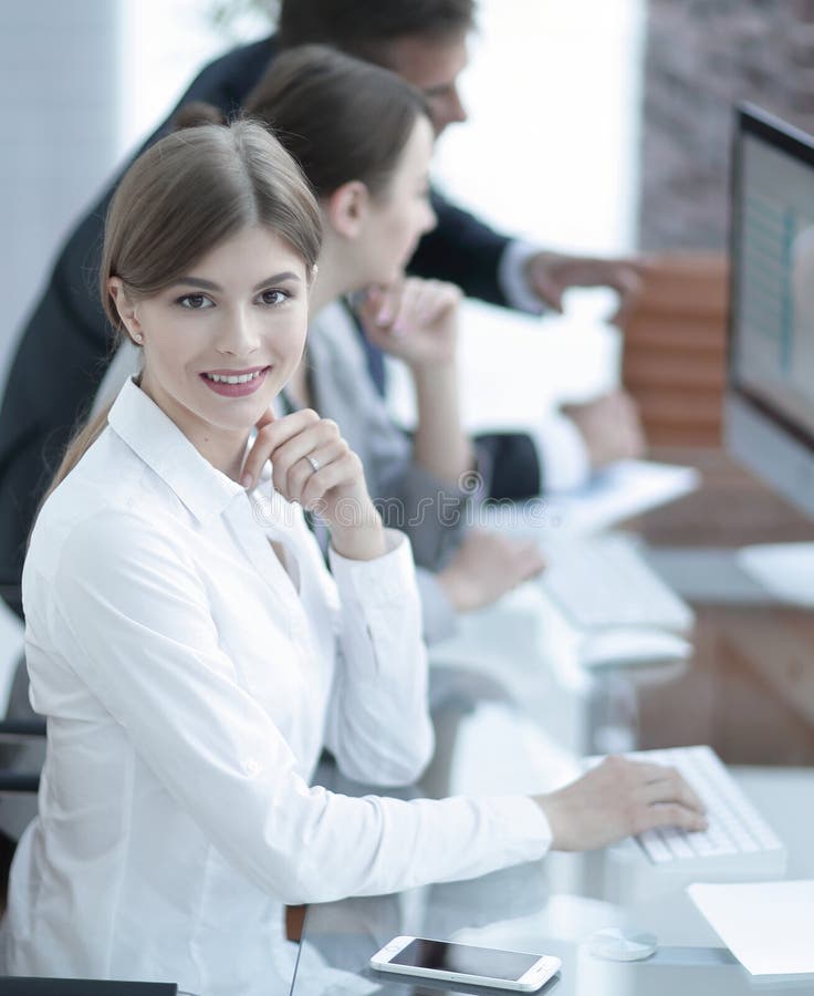 Young Employee Sitting at a Desk Stock Image - Image of caucasian ...