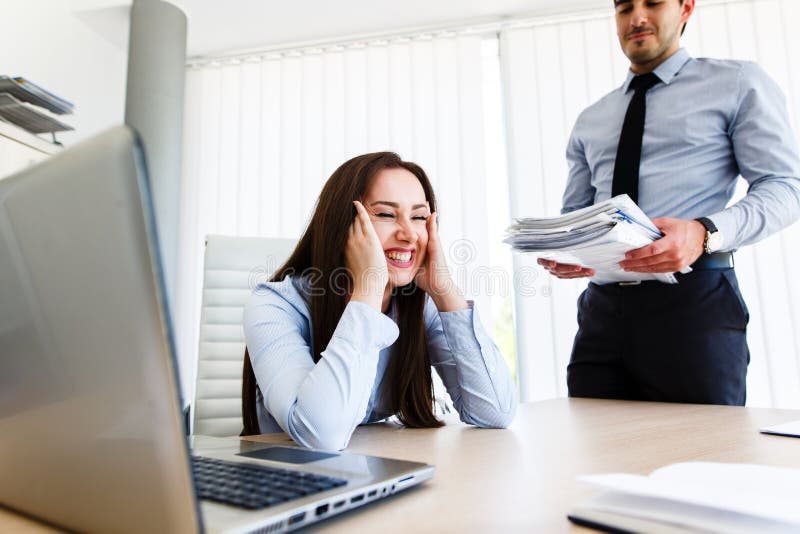 Young Employee Smiles when she Gets a Lot of Tasks Stock Image - Image ...