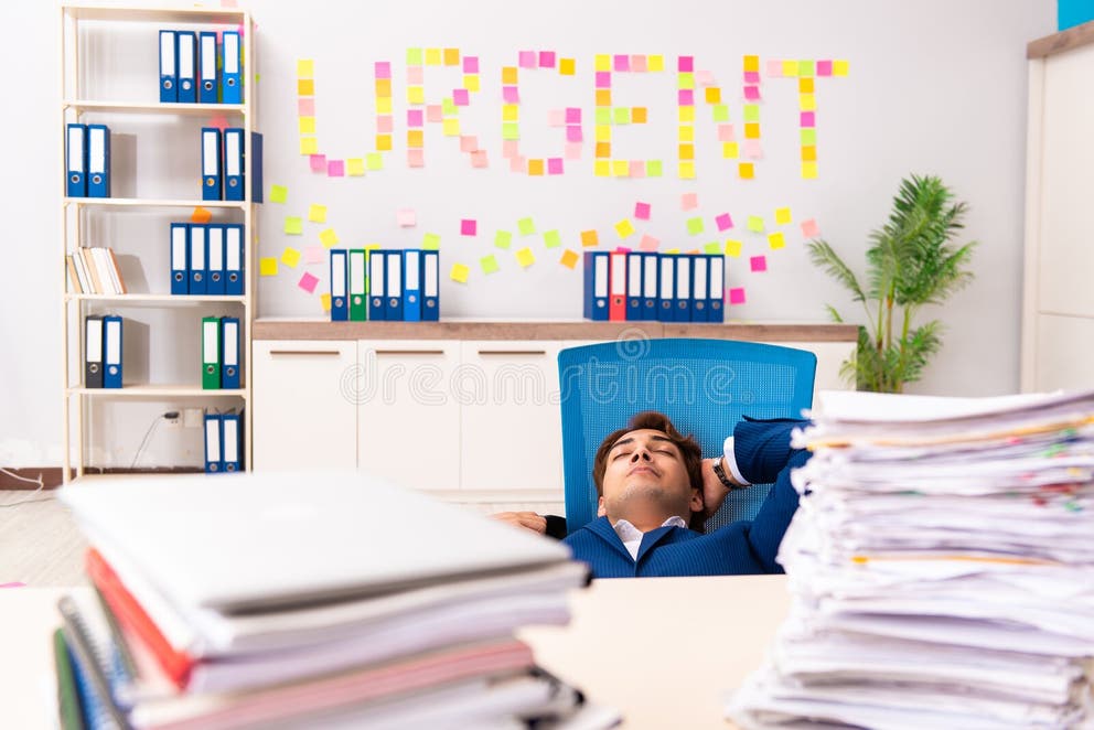 The Young Employee Suffering from Excessive Work Stock Image - Image of ...