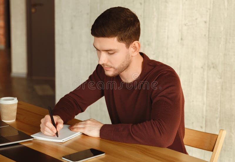 Young Employee Taking Notes Sitting in Modern Office Stock Image ...
