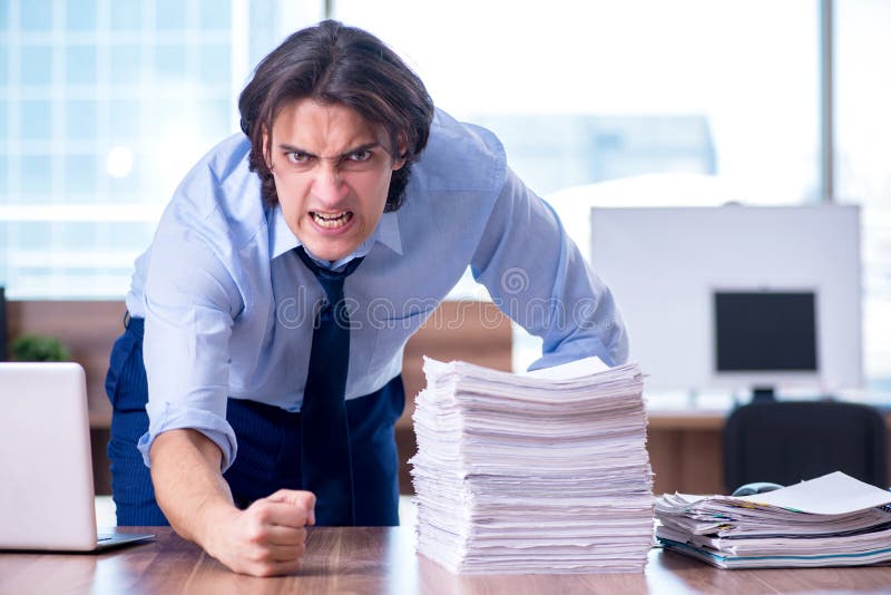 Young Employee Unhappy with Excessive Work Stock Photo - Image of ...
