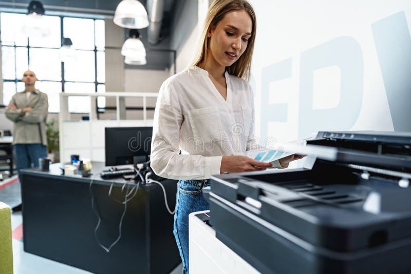 Young Employee Using Modern Printer in Office Stock Photo - Image of ...