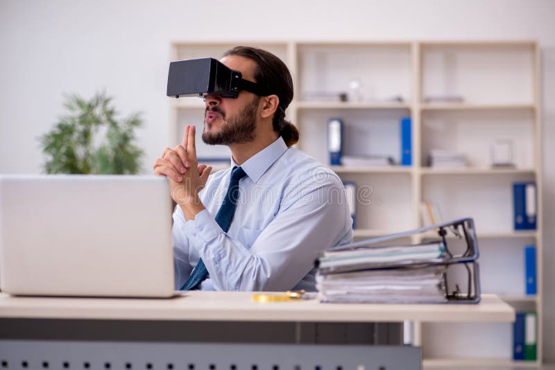 Young Male Employee Wearing Virtual Glasses at Workplace Stock Photo ...