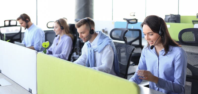 Young Employee Working with a Headset and Accompanied by Her Team ...