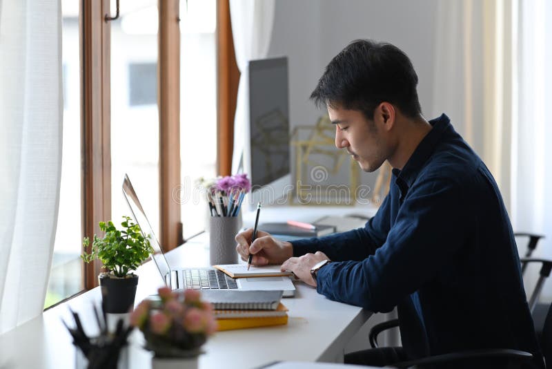 Employee Working with Laptop Computer at Bright Office. Stock Image ...