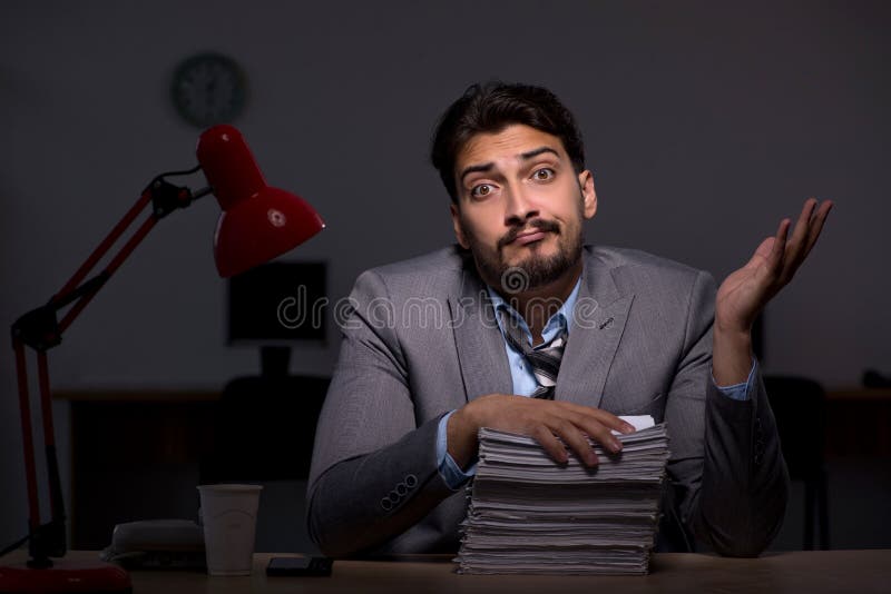 Young Male Employee Working Late in the Office Stock Image - Image of ...