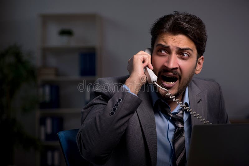 Young Male Employee Working Late in the Office Stock Image - Image of ...