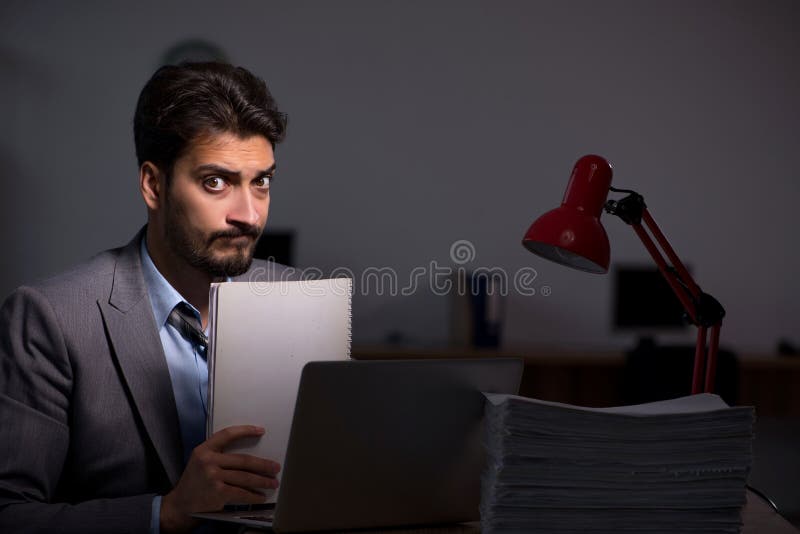 Young Male Employee Working Late in the Office Stock Image - Image of ...