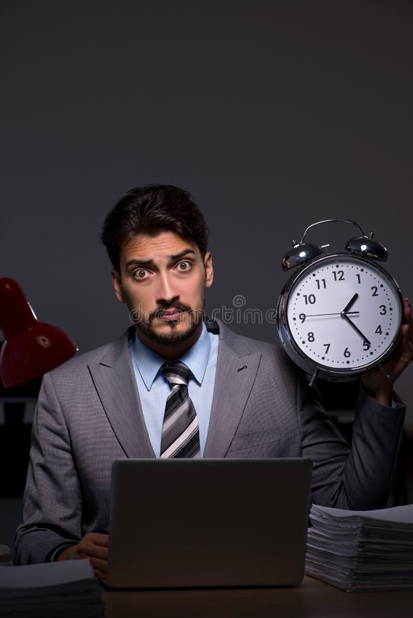 Young Male Employee Working Late in the Office Stock Image - Image of ...