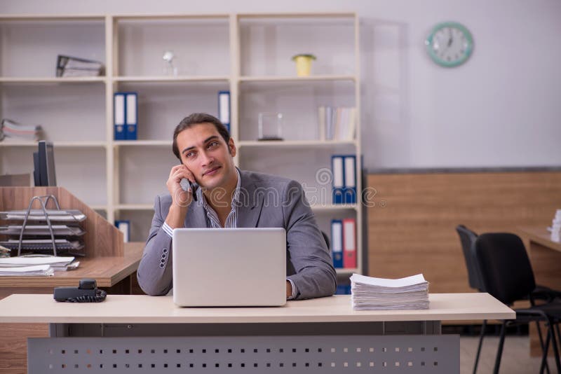 Young Male Employee Working in the Office Stock Photo - Image of ...