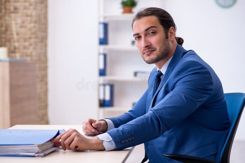 Young Male Employee Working at Workplace Stock Image - Image of ...