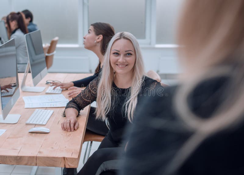 Young Employees Communicate at the Workplace in the Office. Stock Photo ...