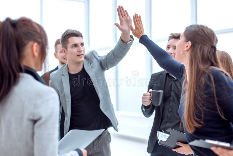 Young Employees Giving Each Other a High Five Stock Image - Image of ...