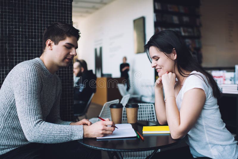 Young Employees Taking Notes at Table during Work Break Stock Image ...