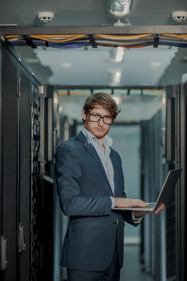 Young it Engeneer Business Man with Thin Modern Aluminium Laptop in ...