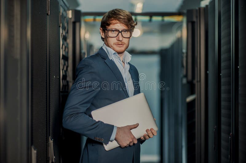 Young it Engeneer Business Man with Thin Modern Aluminium Laptop in ...