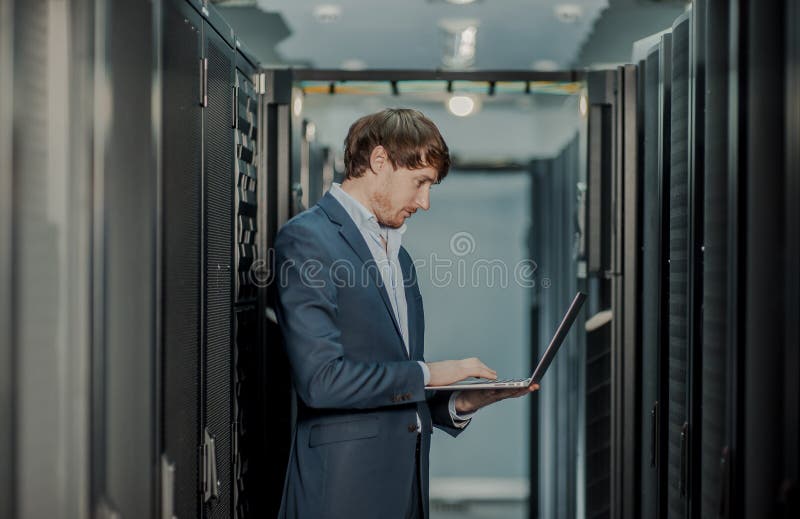 Young it Engeneer Business Man with Thin Modern Aluminium Laptop in ...