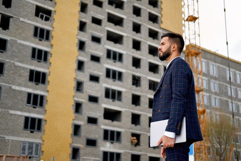 Young Engineer or Architect Working with Laptop Computer a at ...