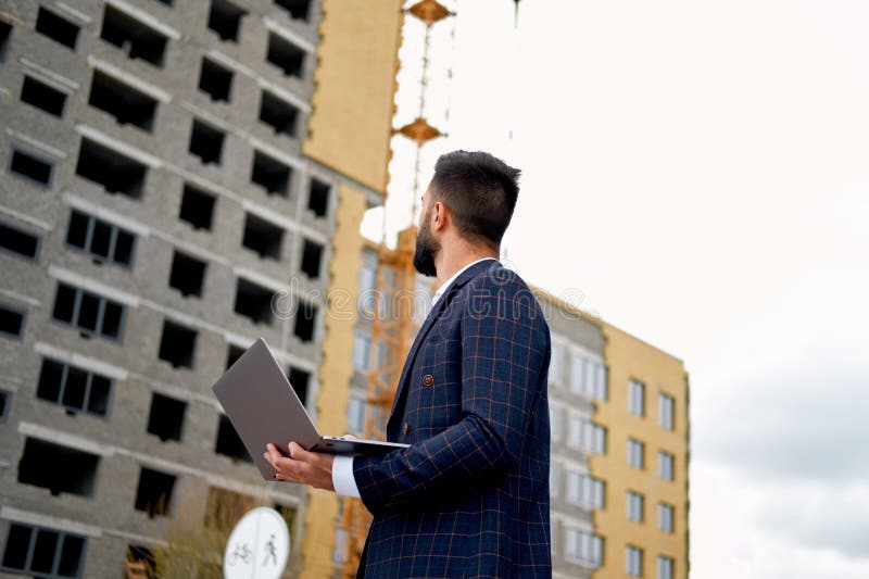Young Engineer or Architect Working with Laptop Computer a at ...