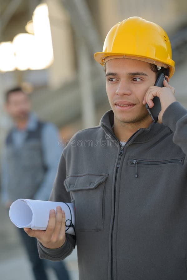 Young engineer on call stock photo. Image of location - 96541114