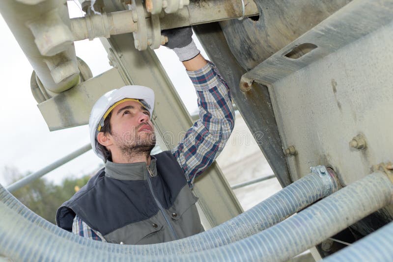 Young Engineer Checking Industrial Site Systems Stock Photo - Image of ...